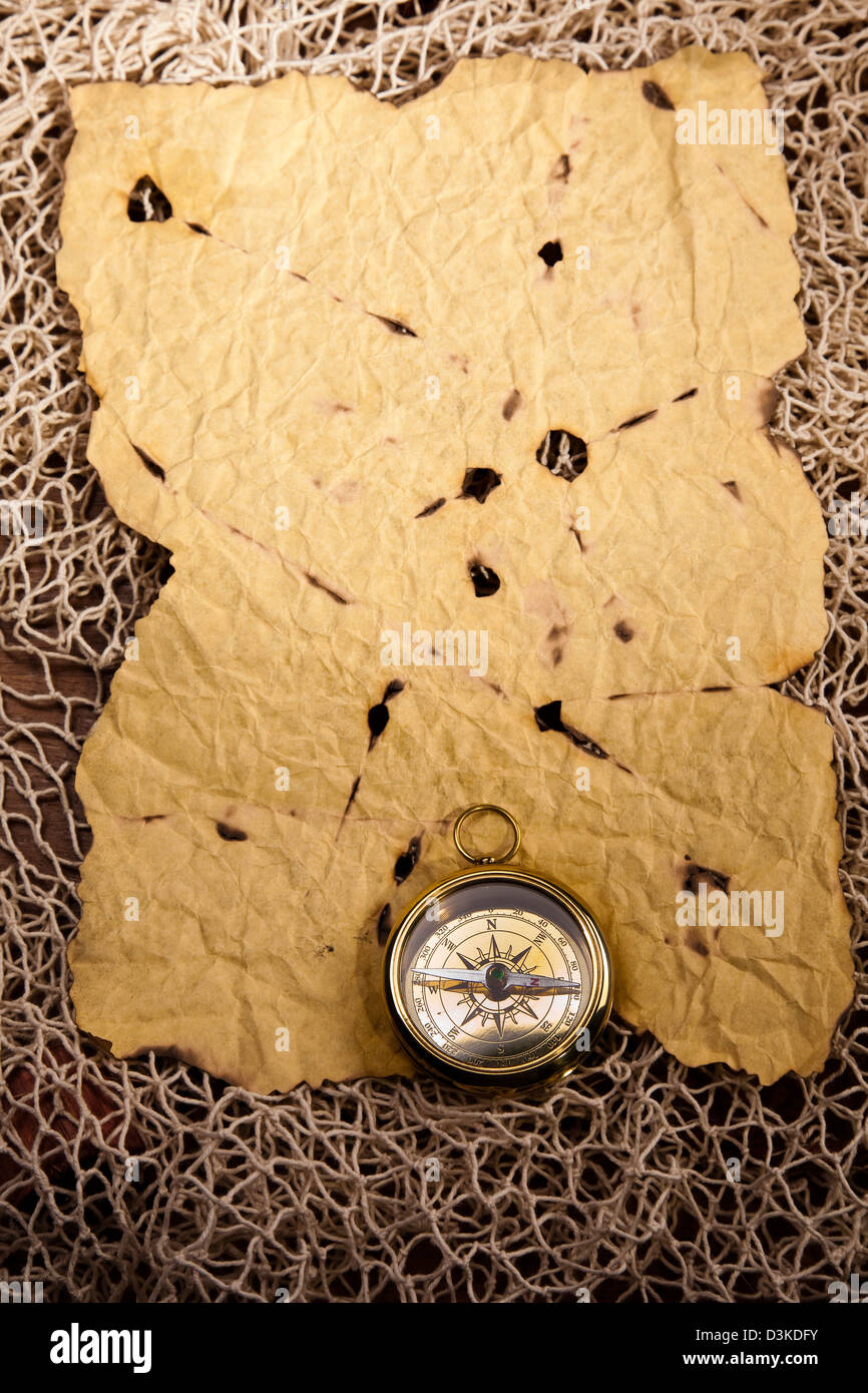 Old style compass and paper background Stock Photo - Alamy
