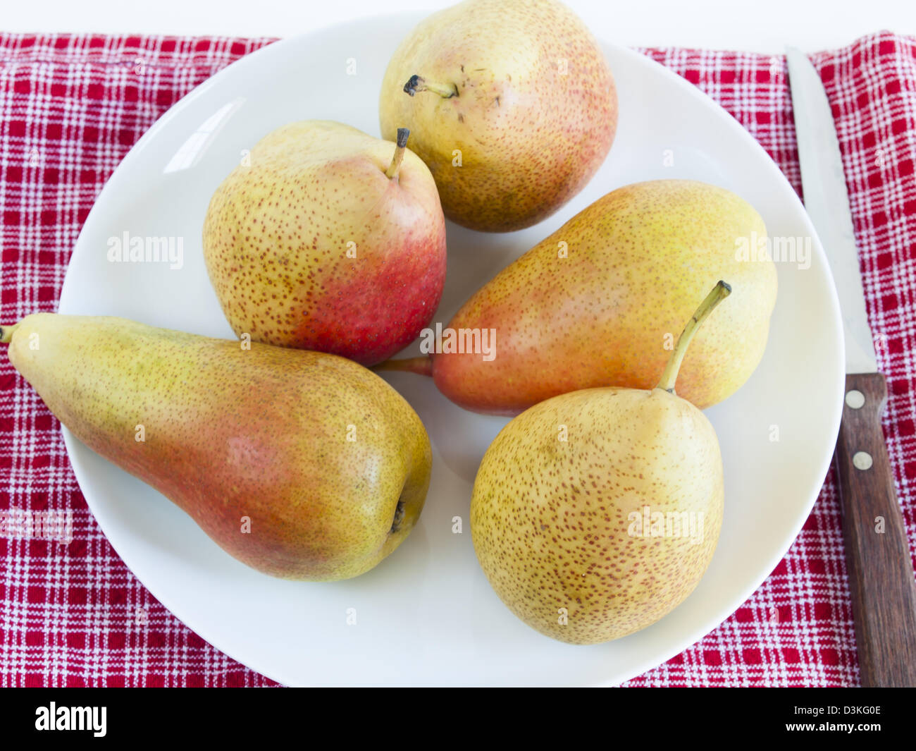 Ripe pear on white background. The cultivation of the pear in cool ...
