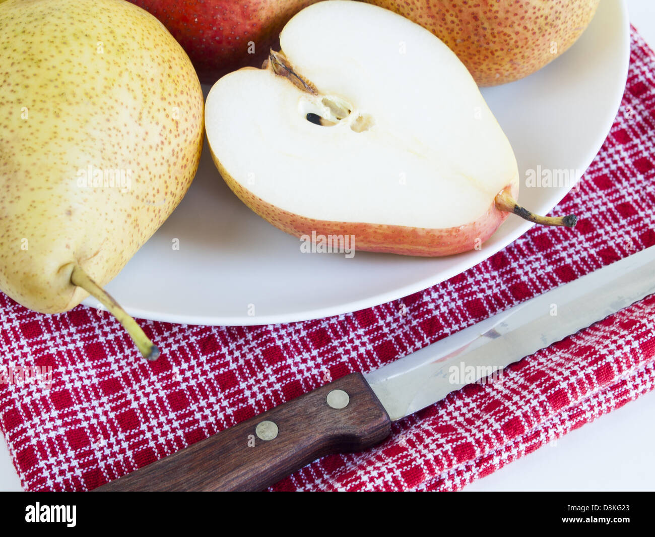Ripe pear on white background. The cultivation of the pear in cool ...