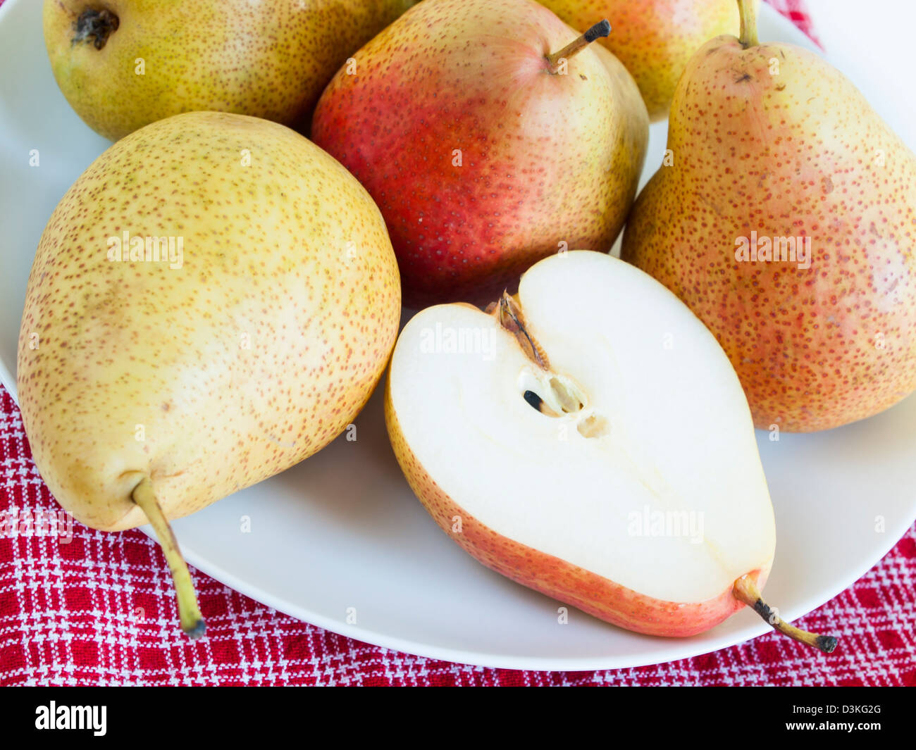 Ripe pear on white background. The cultivation of the pear in cool ...