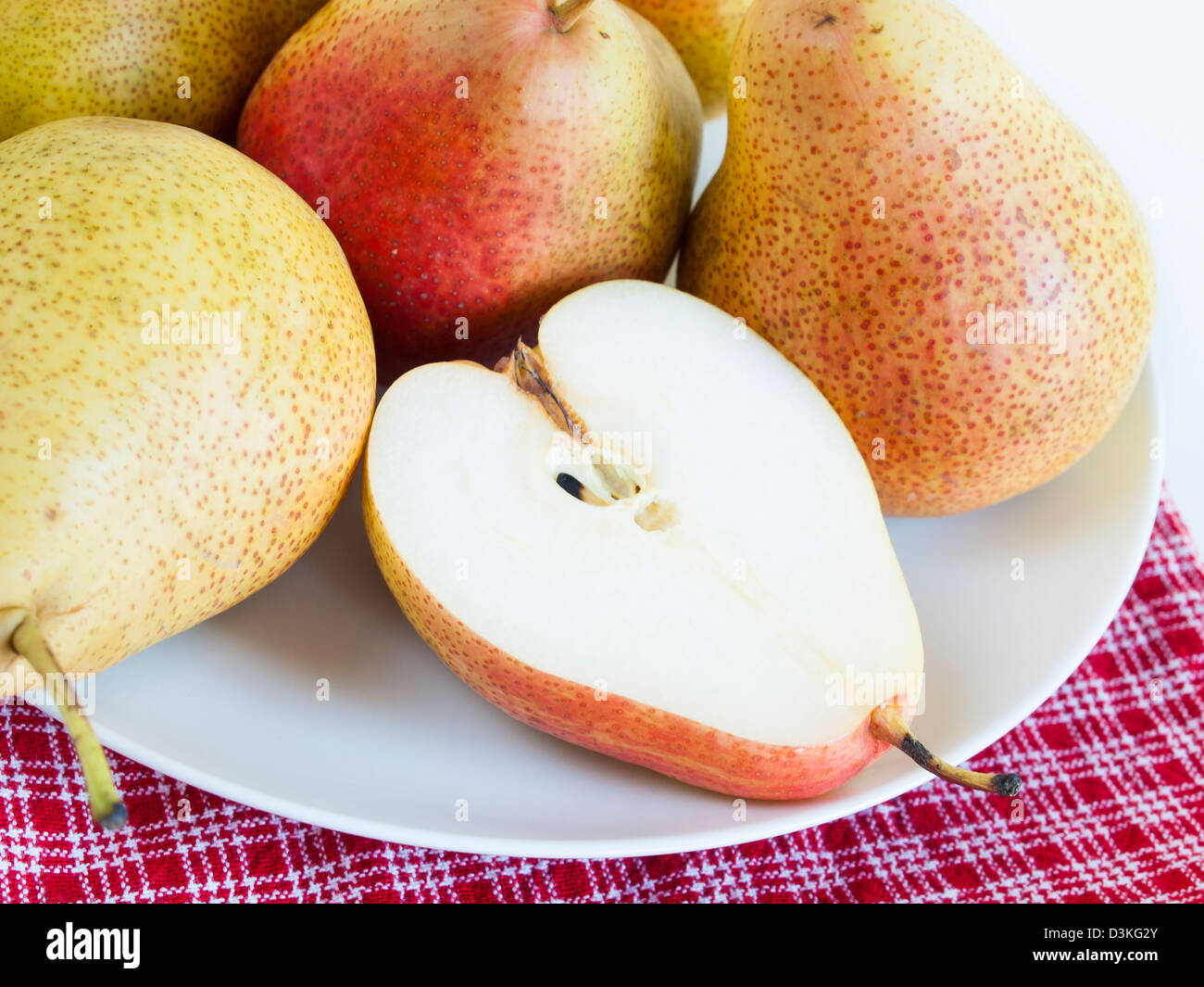 Ripe pear on white background. The cultivation of the pear in cool ...