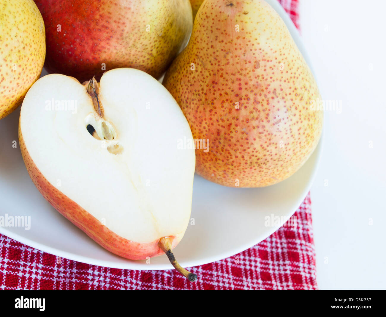 Ripe pear on white background. The cultivation of the pear in cool ...