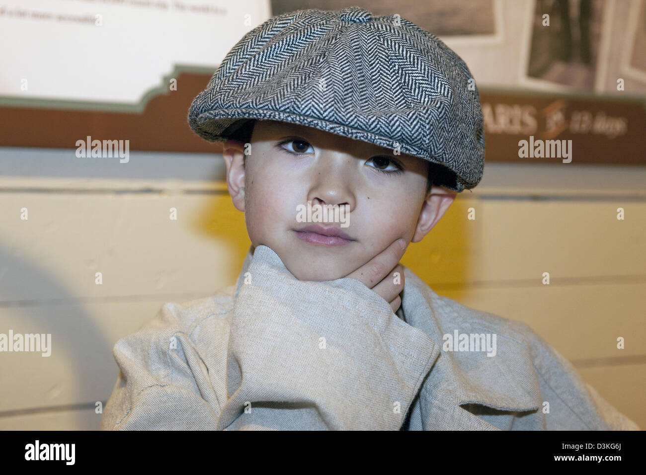 A young boy dresses up in early 1900's clothing Stock Photo - Alamy