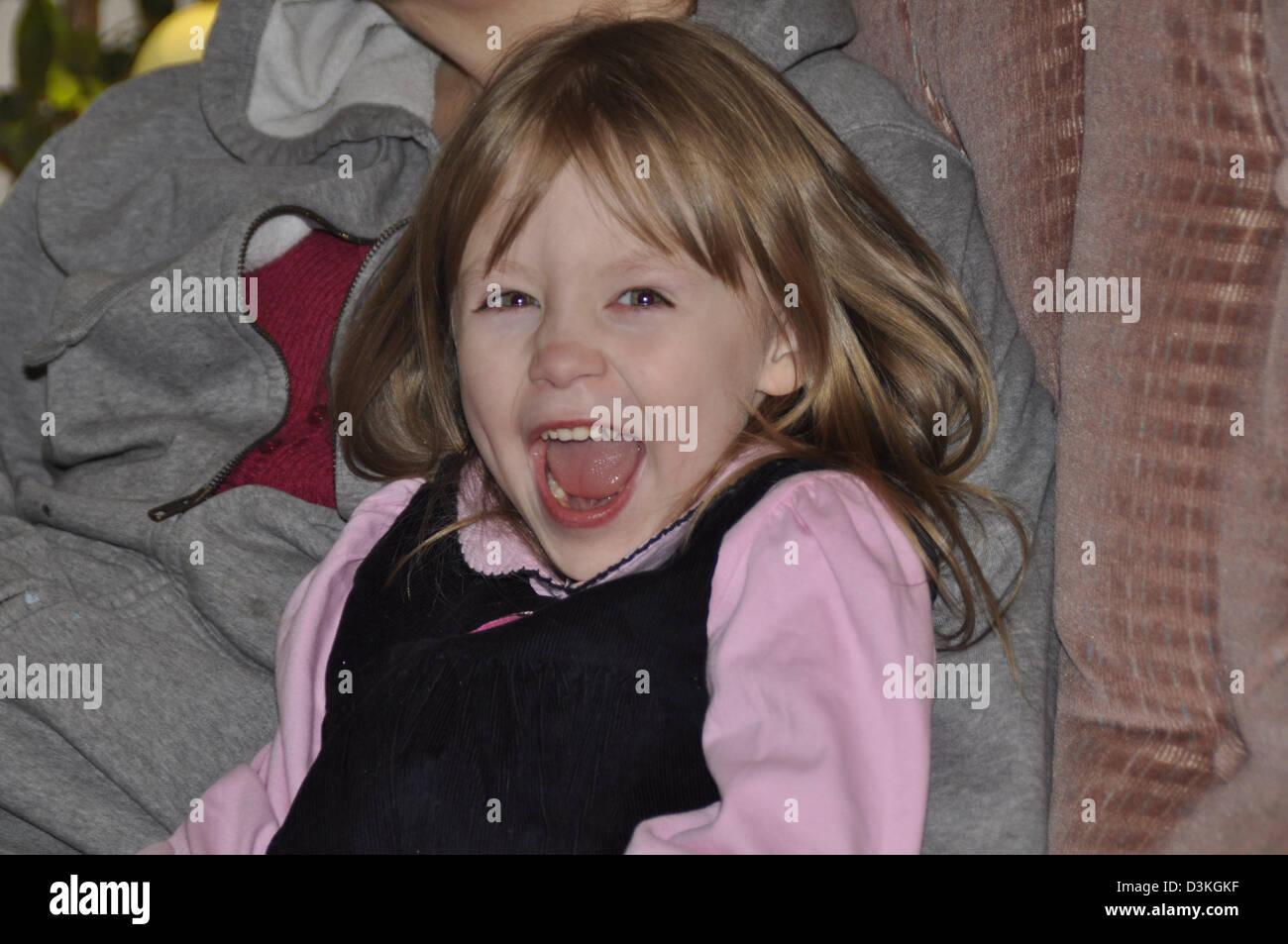 Small happy child reacts to her picture being taken Stock Photo - Alamy