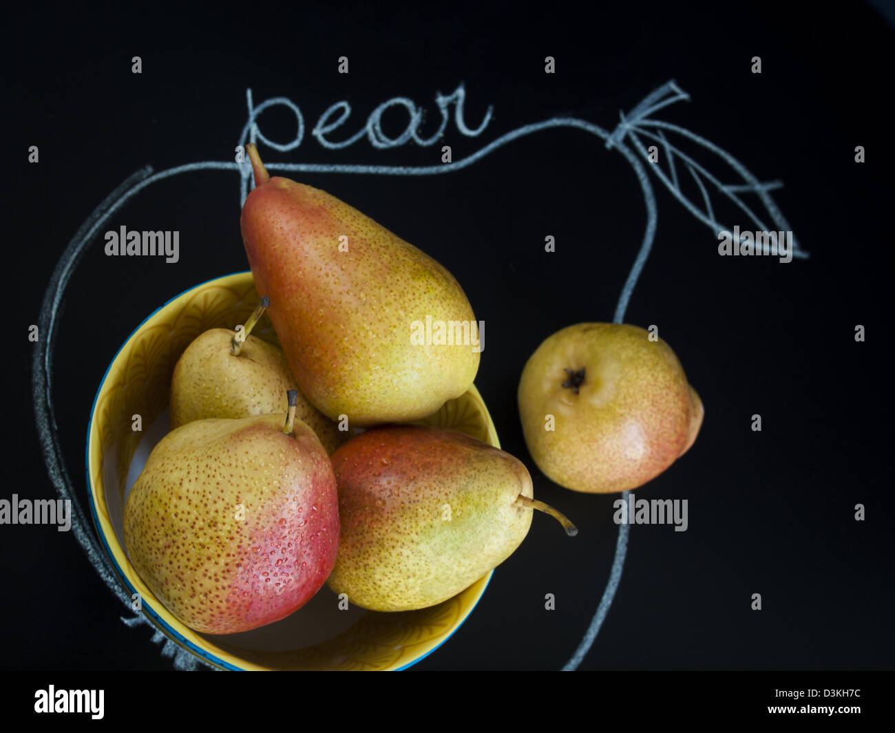 Ripe pear on black background. The cultivation of the pear in cool ...