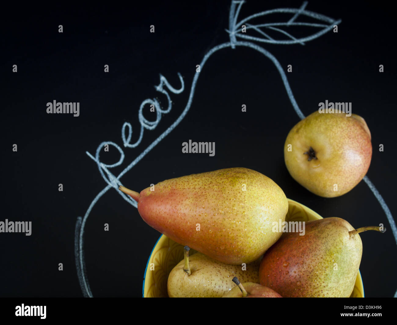Ripe pear on black background. The cultivation of the pear in cool ...