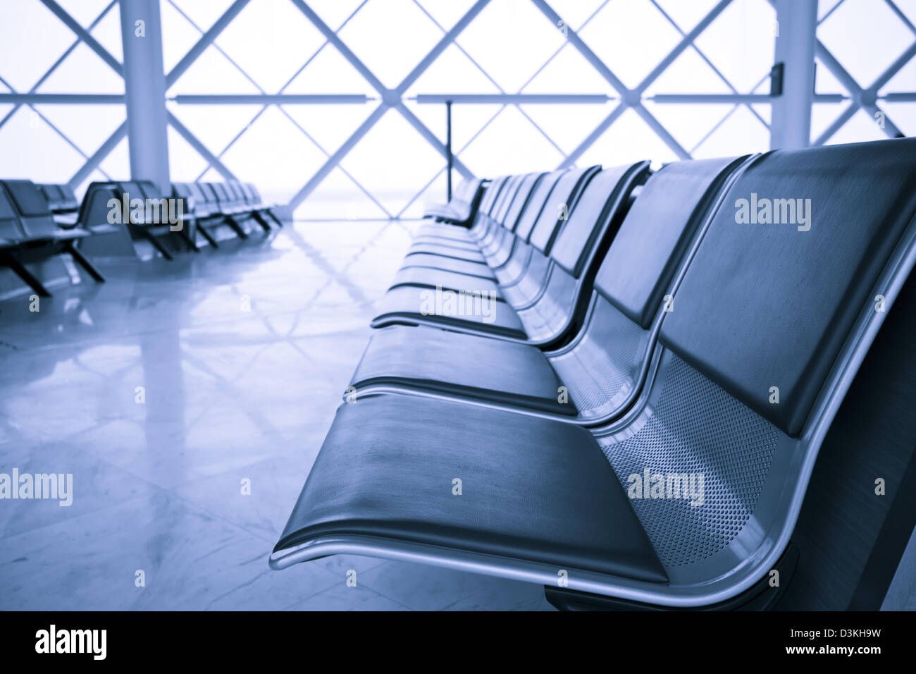 Airport terminal waiting area, blue toned Stock Photo - Alamy