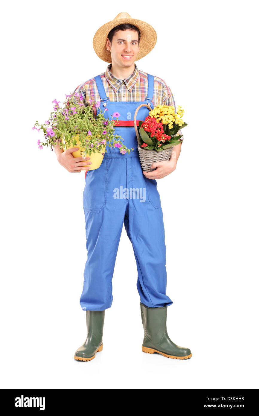 Full length portrait of a male gardener holding plants isolated on ...