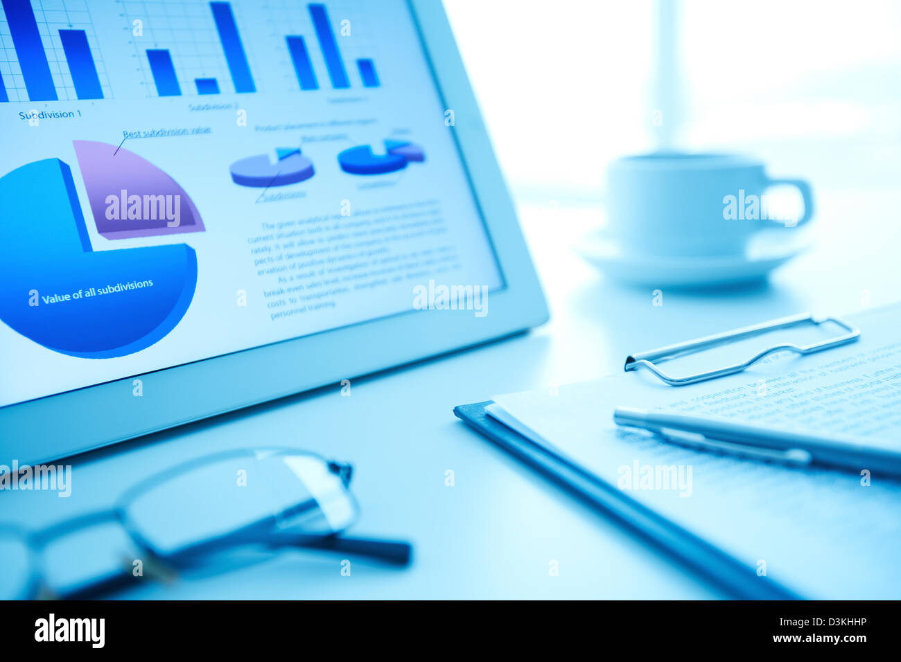 Image of workplace with electronic document and business objects on ...