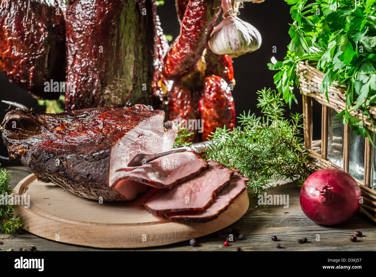 Freshly sliced ham on the table rural Stock Photo - Alamy