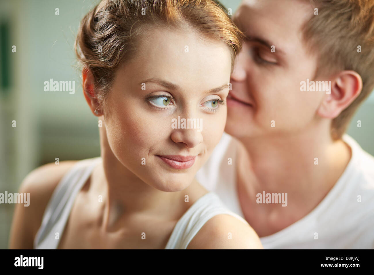 Portrait of calm young woman being cuddled by loving man Stock Photo ... Portrait of calm young woman being cuddled by loving man Stock Photo ...