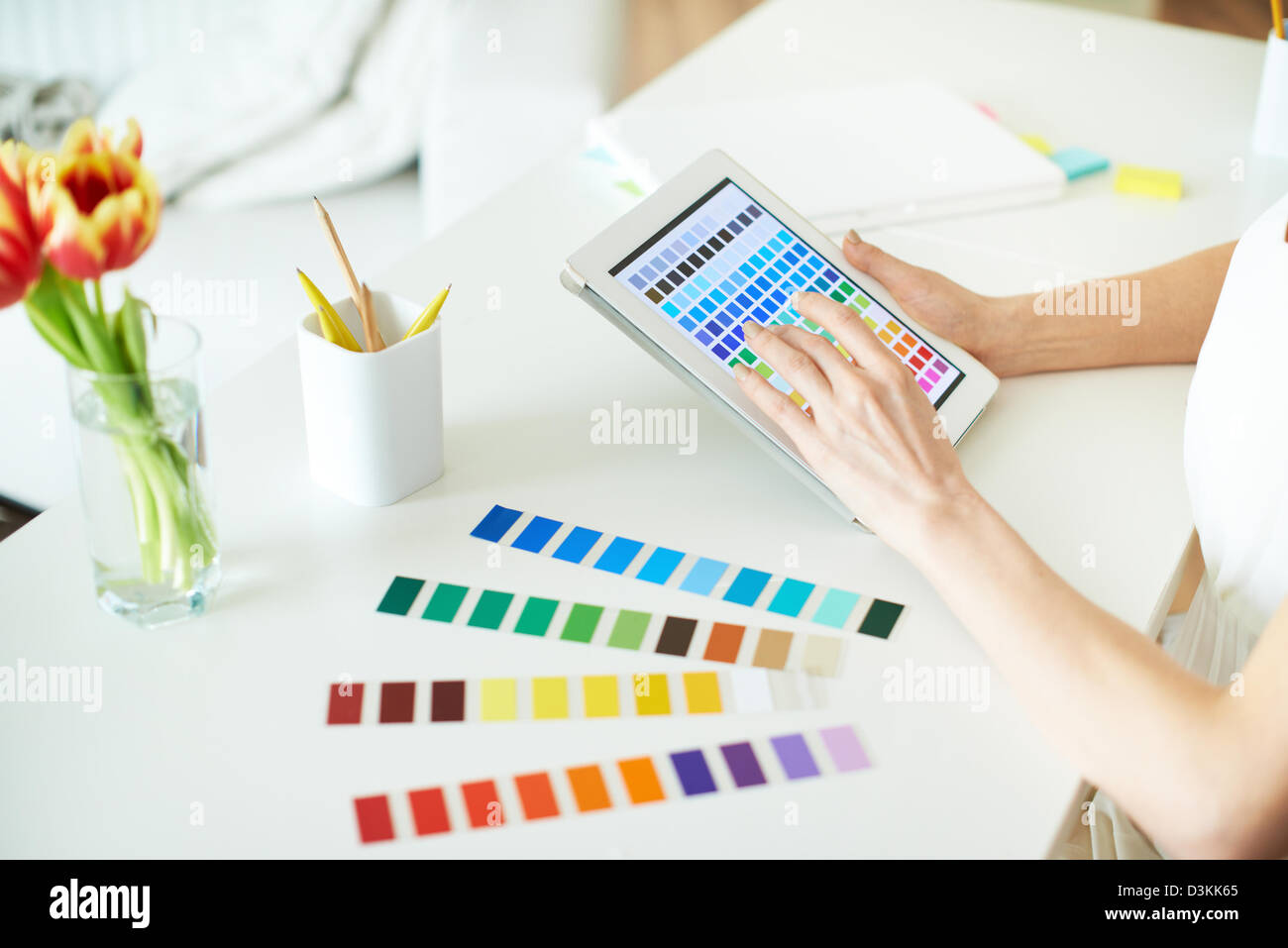 Female designer working with colors in touchpad Stock Photo - Alamy