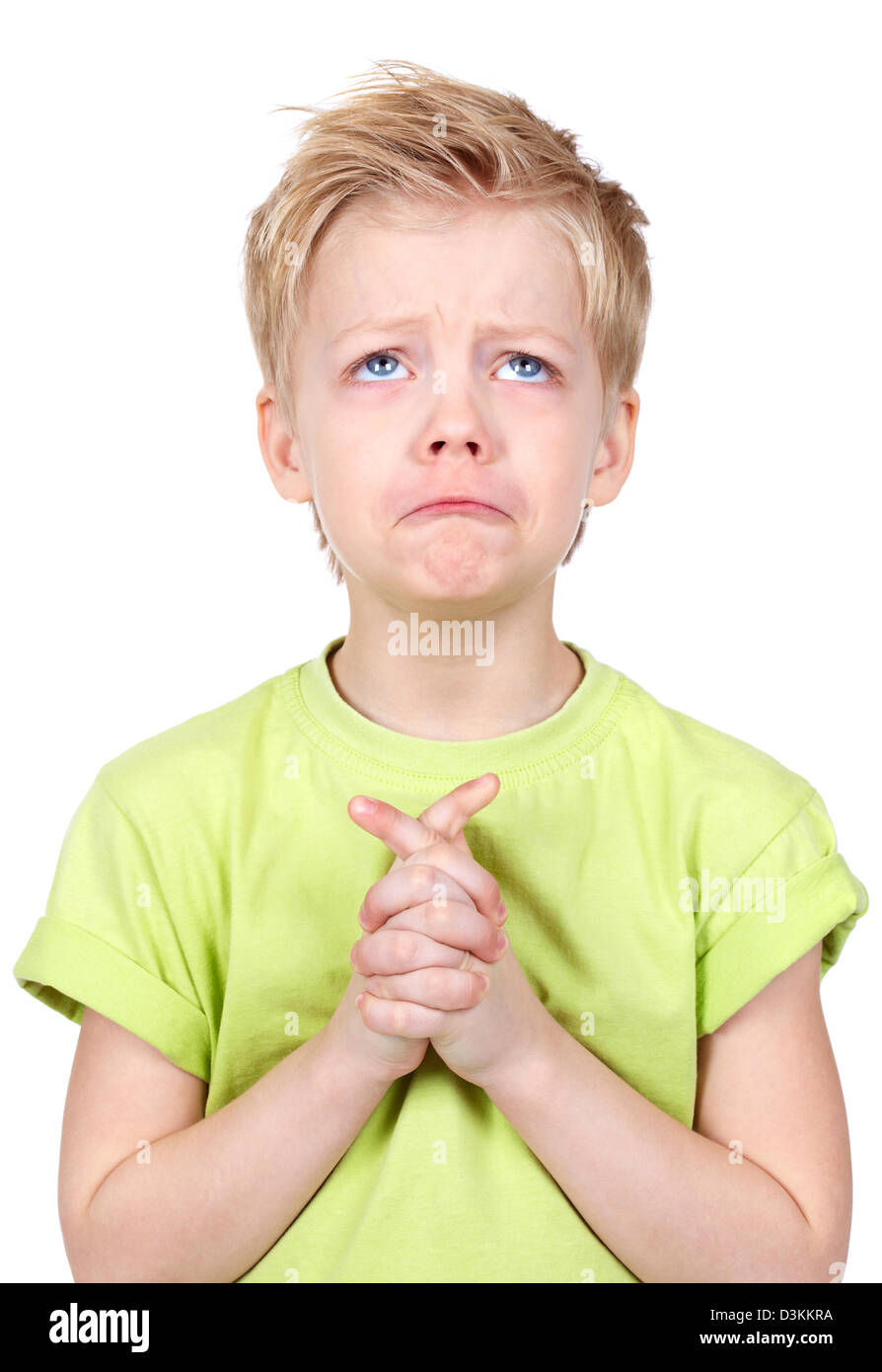 Cute kid putting his hands together as if begging for something Stock ...