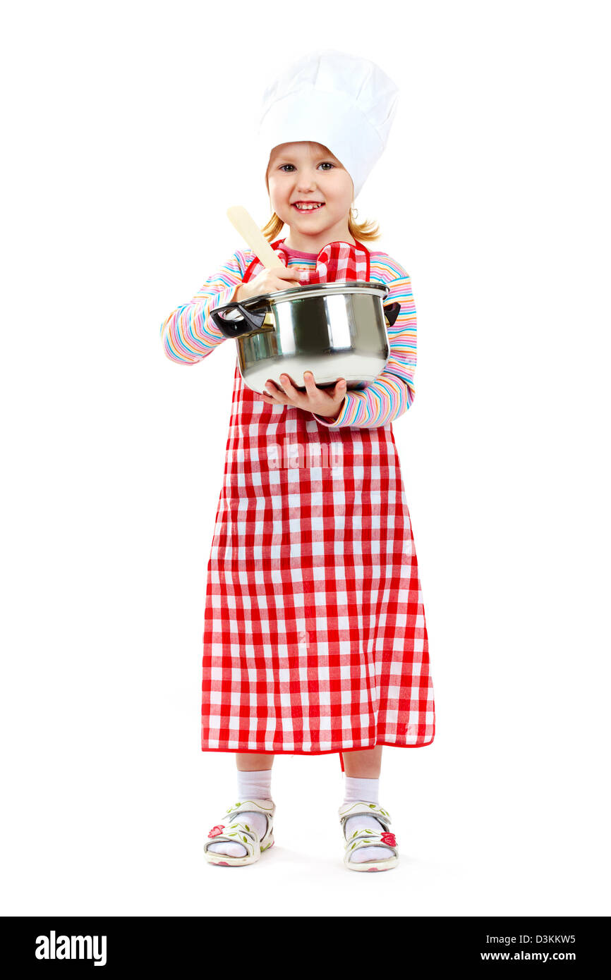 Girl in an apron and cook cap cooking delicious meal Stock Photo - Alamy