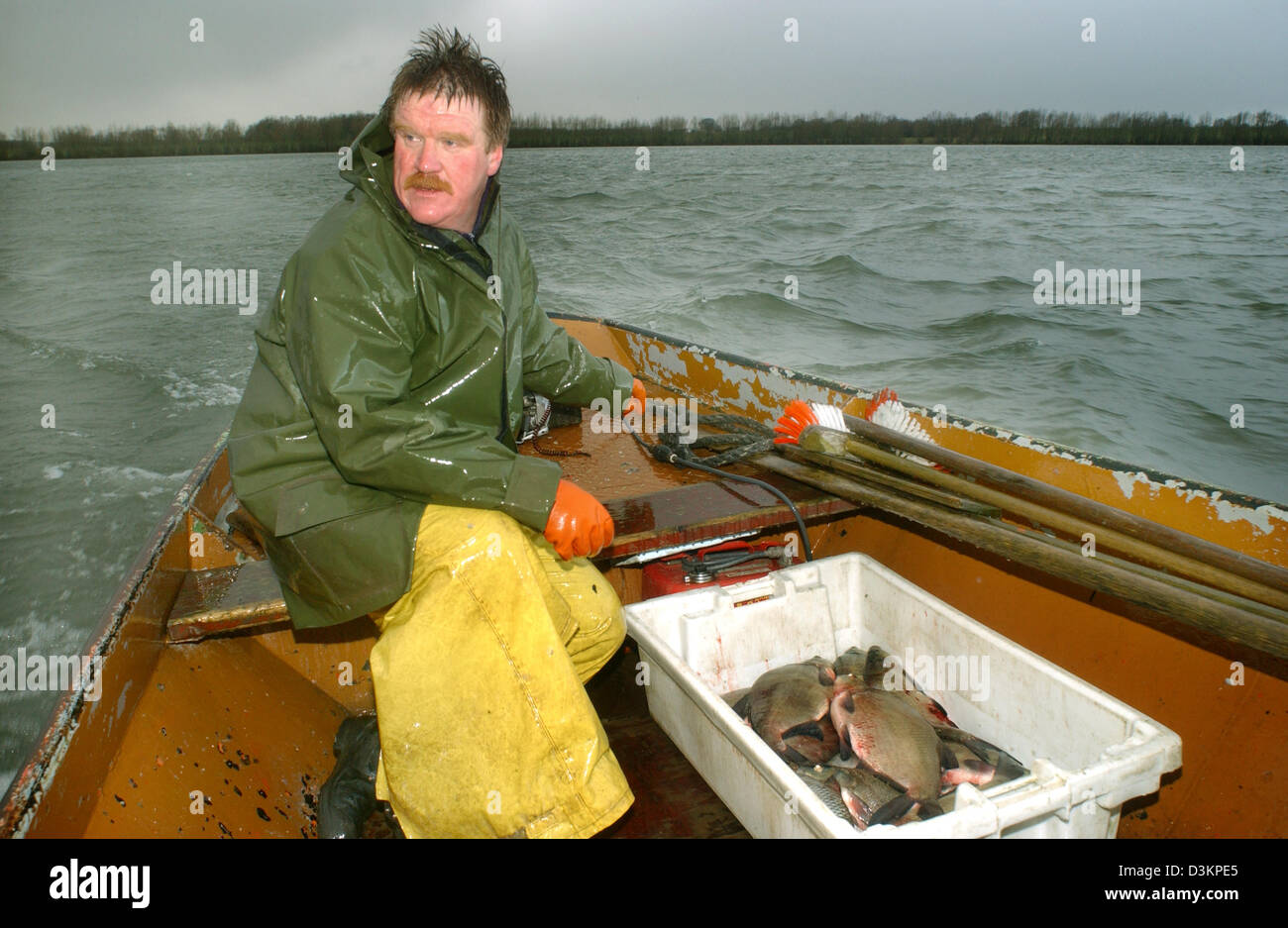 (dpa) - Fisherman Gerhard Steinling sits at the bow of his fishing boat ...