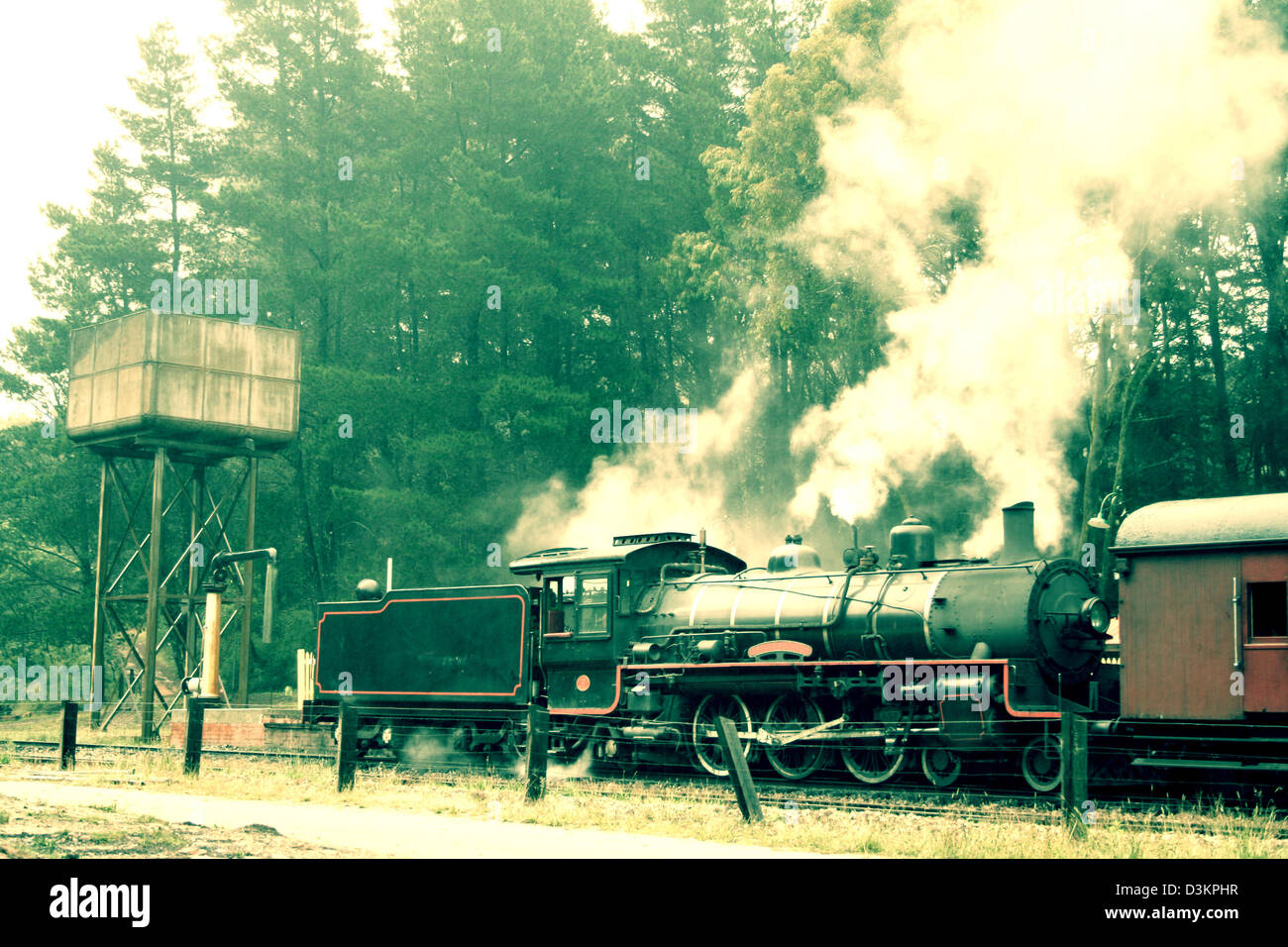 Vintage steam train pushing a carriage Stock Photo - Alamy