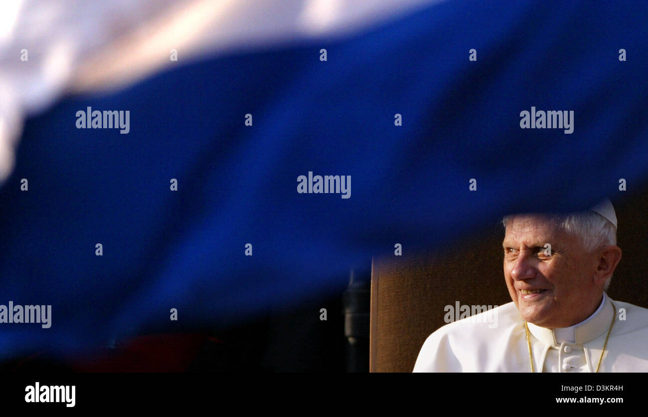 (dpa) - Pope Benedict XVI is pictured behind a flag during the World ...