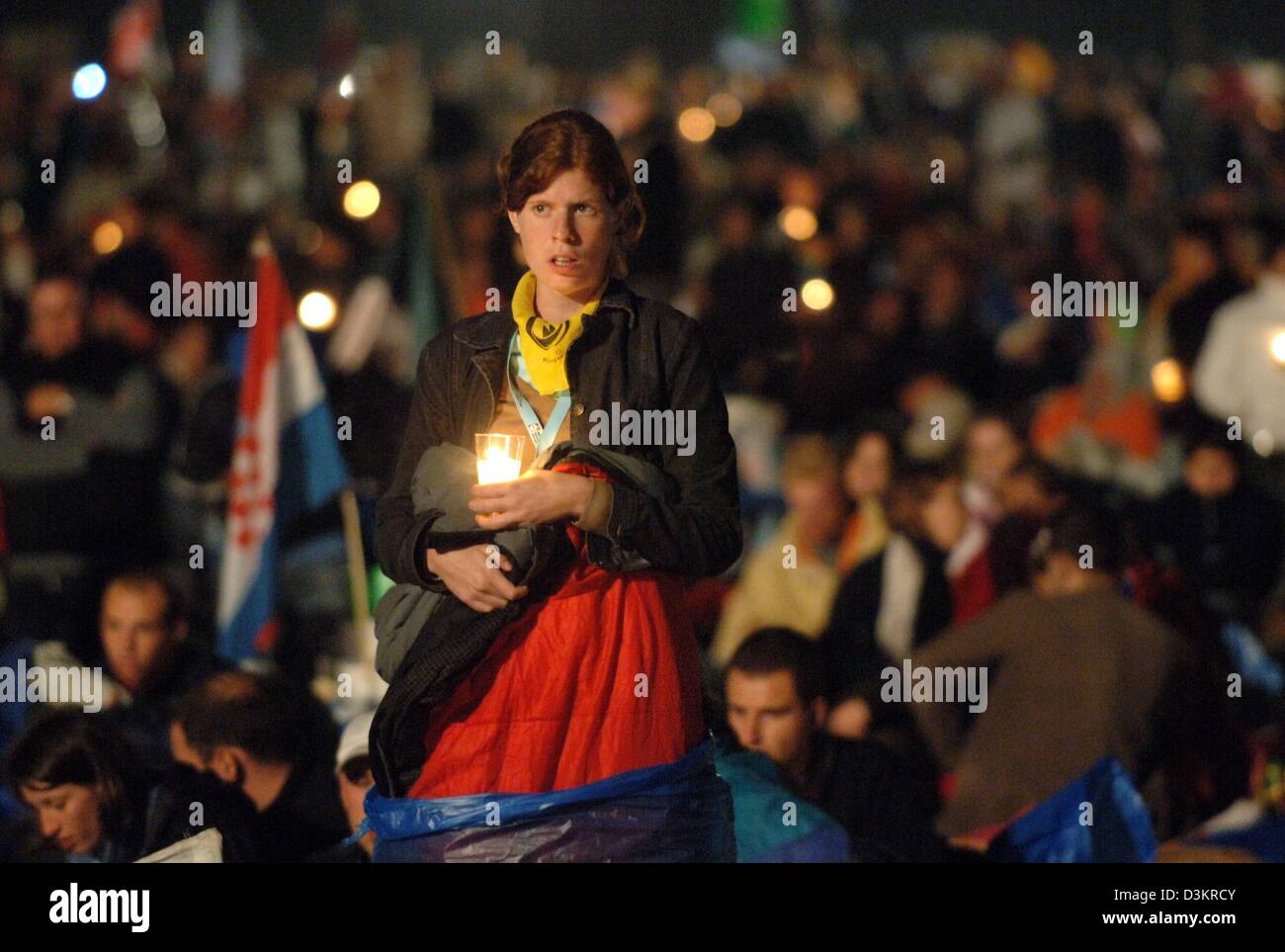 (dpa) - A pilgrim prays during the evening mass on the Marien hill near ...