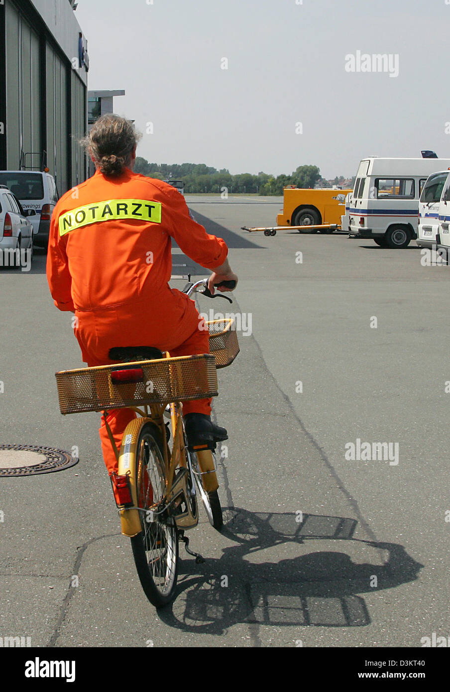 (dpa) - Emergency physician Walter Weber rides his bike at the German ...