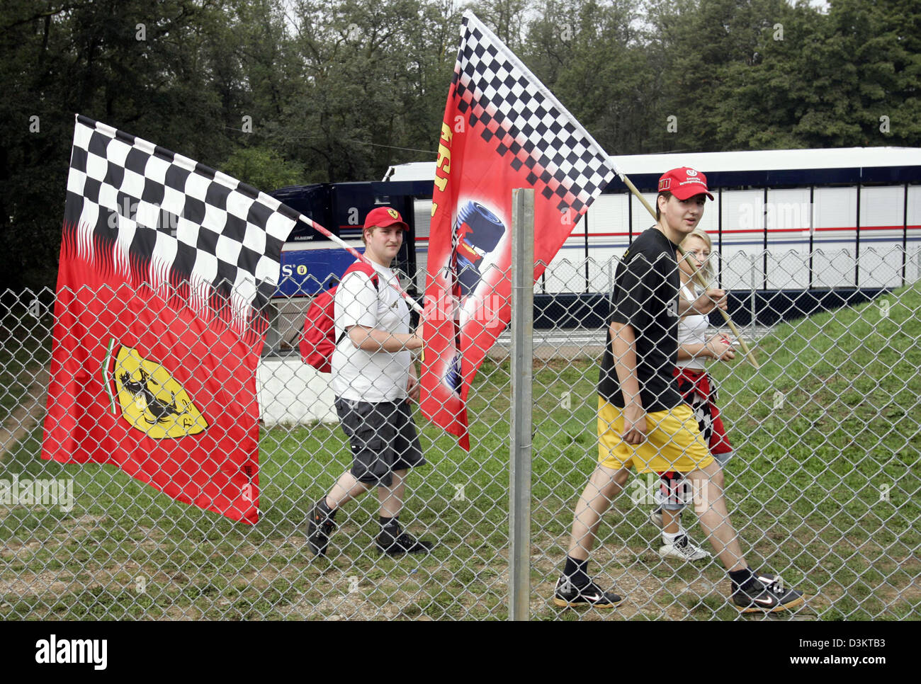 (dpa) - Ferrari fans walk along the track during the first training ...