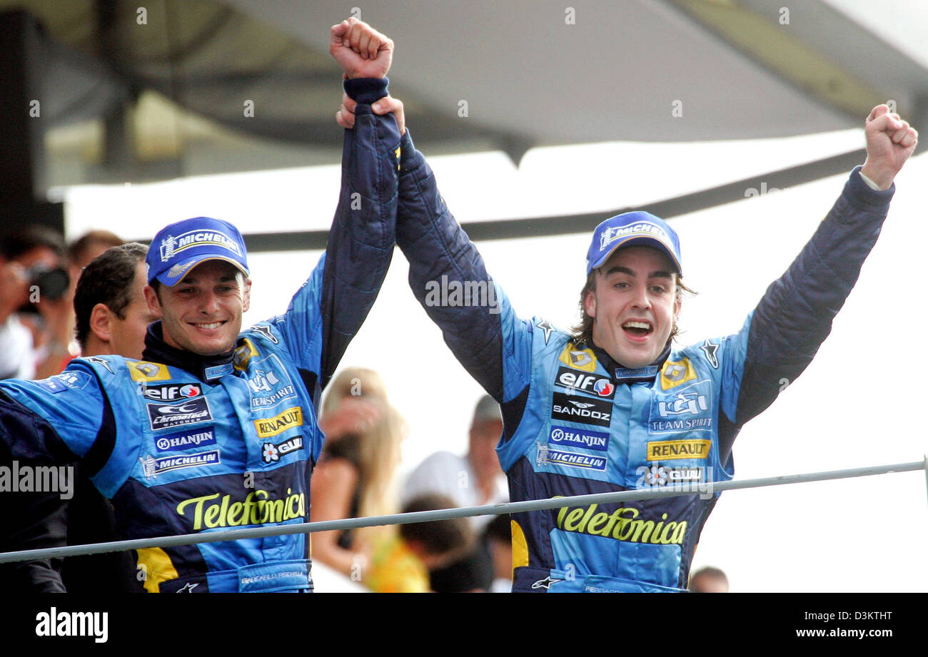 Spanish Formula One driver Fernando Alonso and his Italian team-mate Giancarlo Fisichella react ...