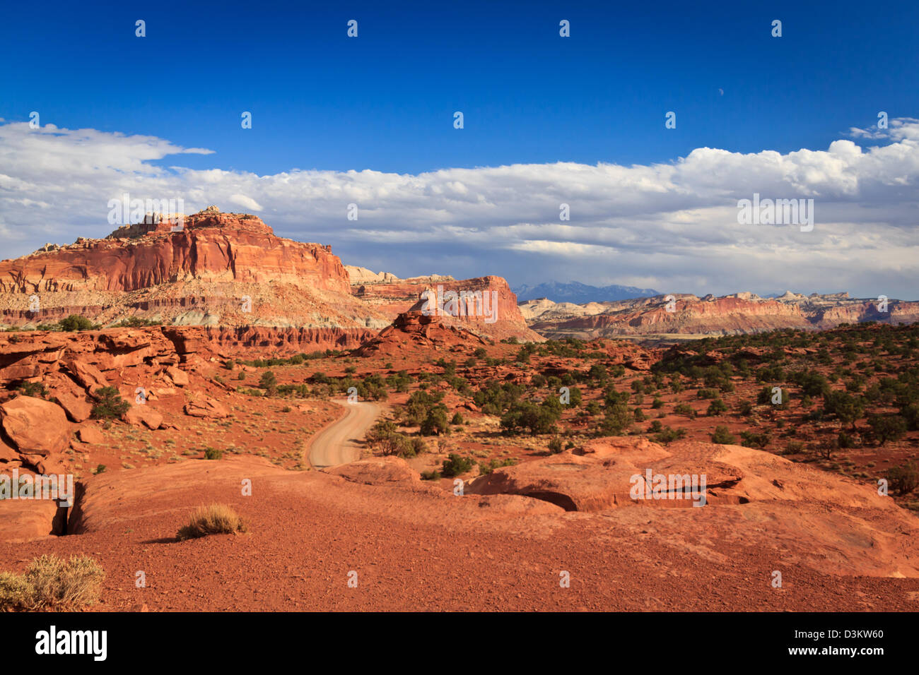 A view of Capitol Reef National Park, red rock under a blue sky, with a ...