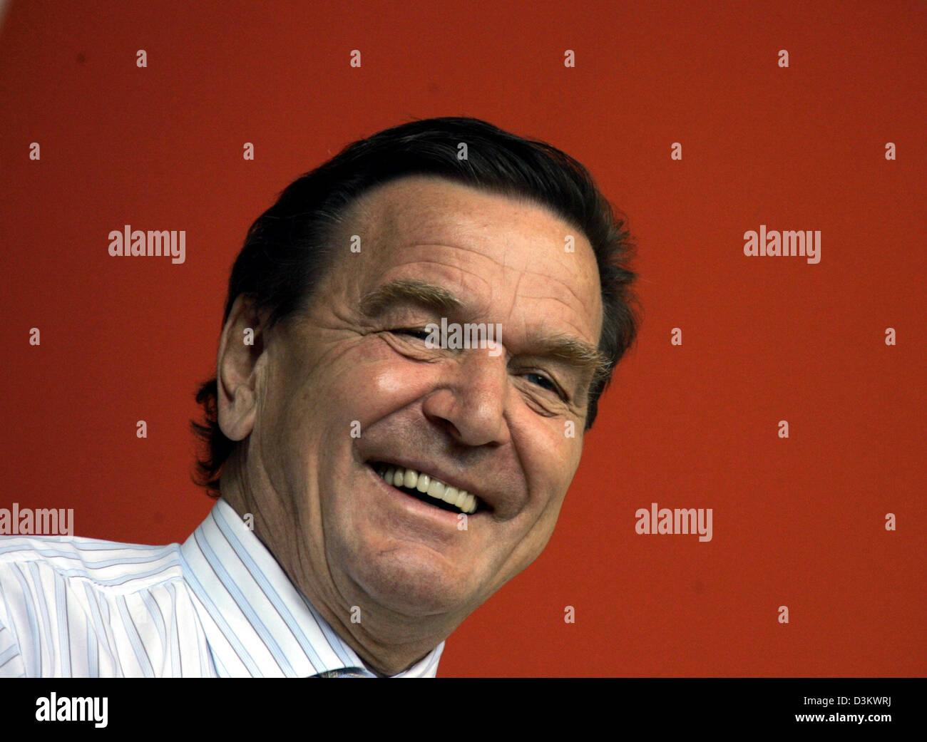(dpa) - German Chancellor Gerhard Schroeder smiles as he takes part in ...