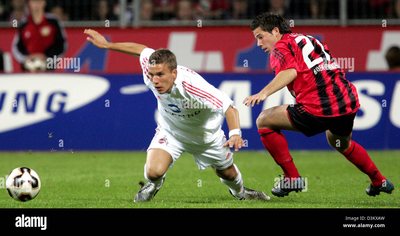 (dpa) - Leverkusen's Gonzalo Castro (R) and Cologne's Lukas Podolski (L ...