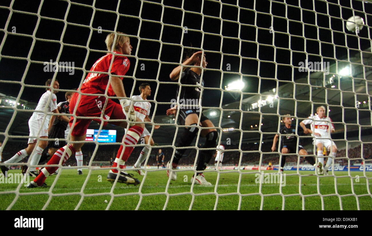 (dpa) - Stuttgart's goalkeeper Timo Hildebrand (L, red tricot) stands ...