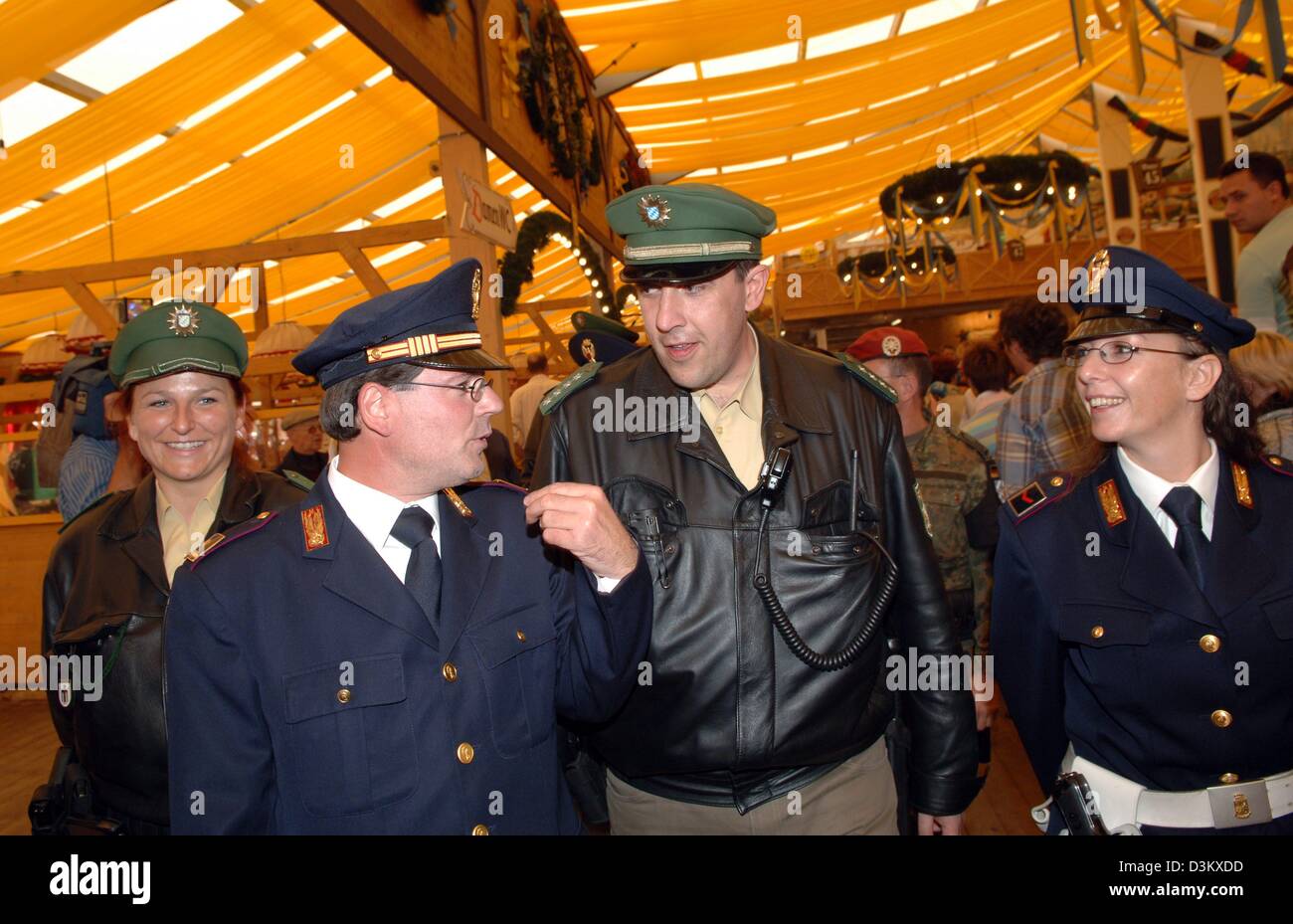 (dpa) - Italian police officers (2nd from L andR) walk side-by-side ...