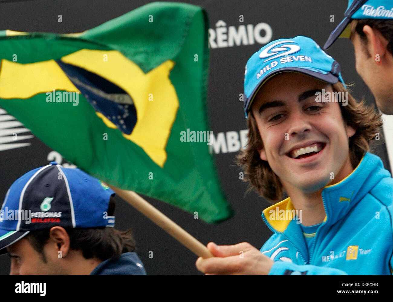 Spanish Formula One driver Fernando Alonso of Renault waves a Brazilian ...