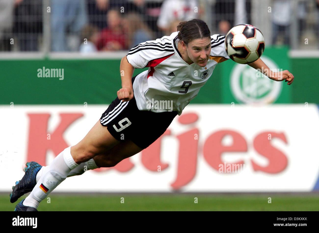 (dpa) - German national team striker Birgit Prinz heads the ball during ...