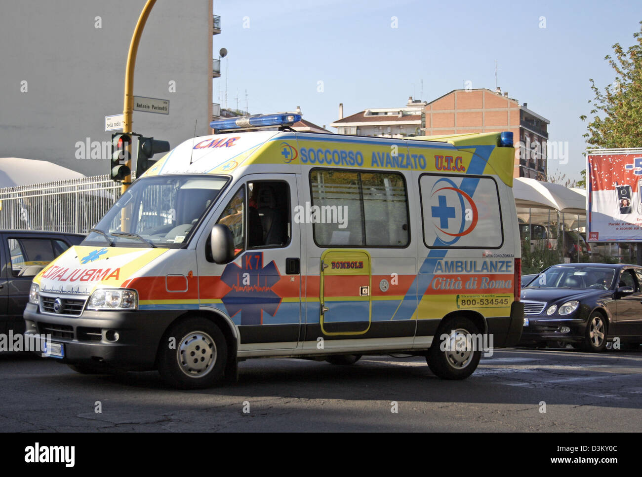 An ambulance drives though traffic jam in downtown Rome, Italy, 16 ...
