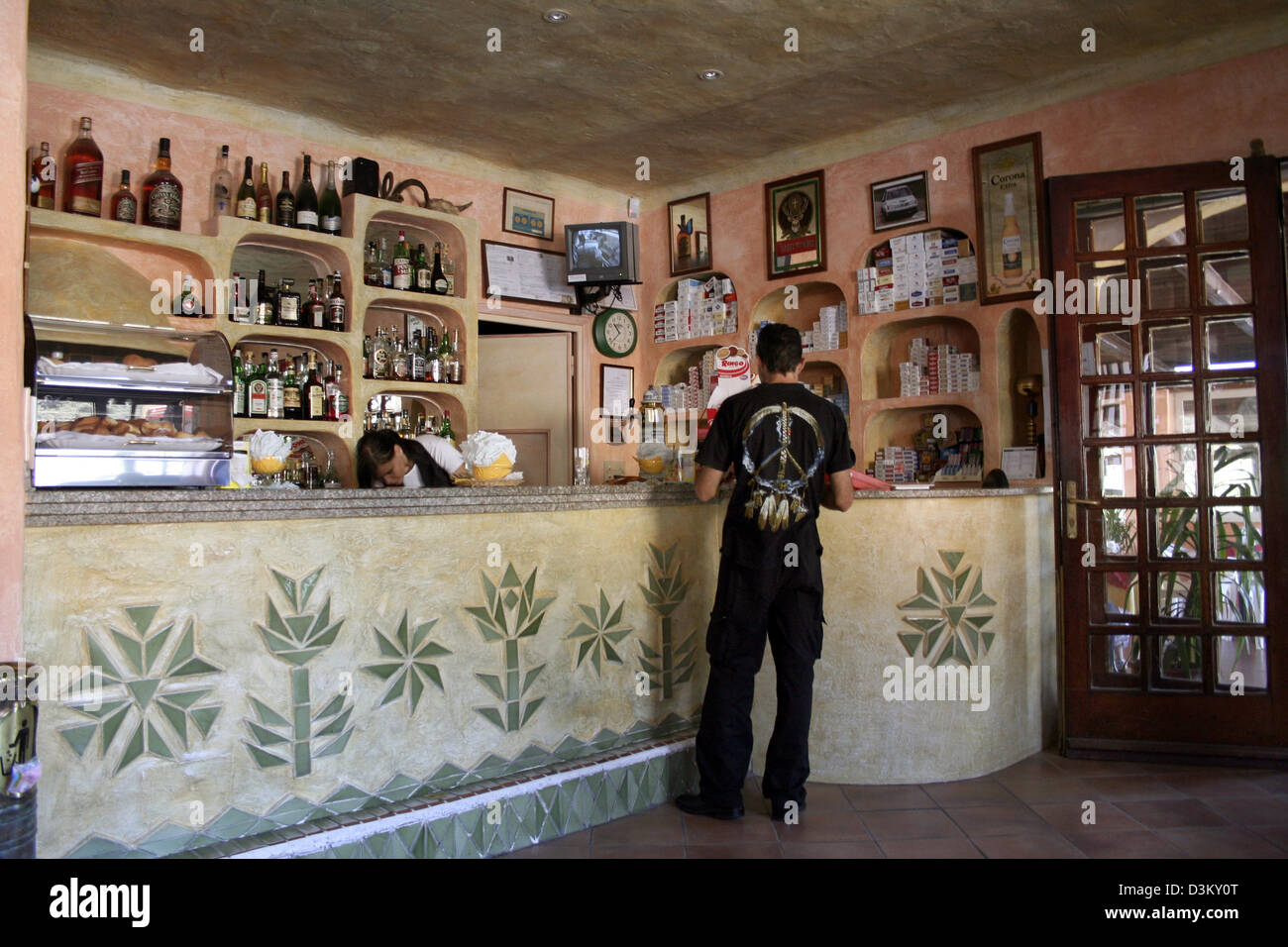 (dpa) - A young man stands at a bar in the town of Porto Cervo on the ...