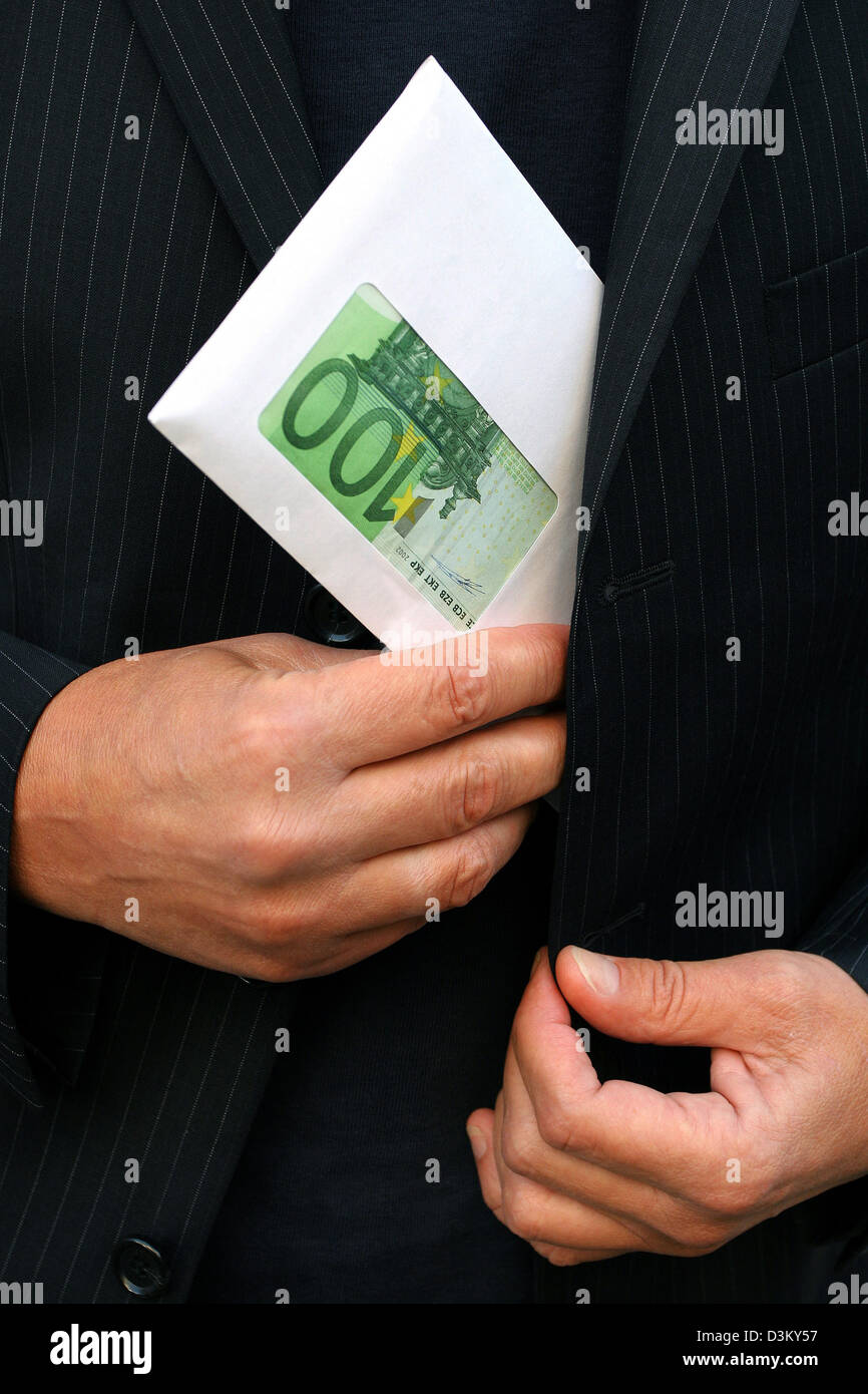 (dpa) - The picture shows the pocketing of a amount of money in a ...