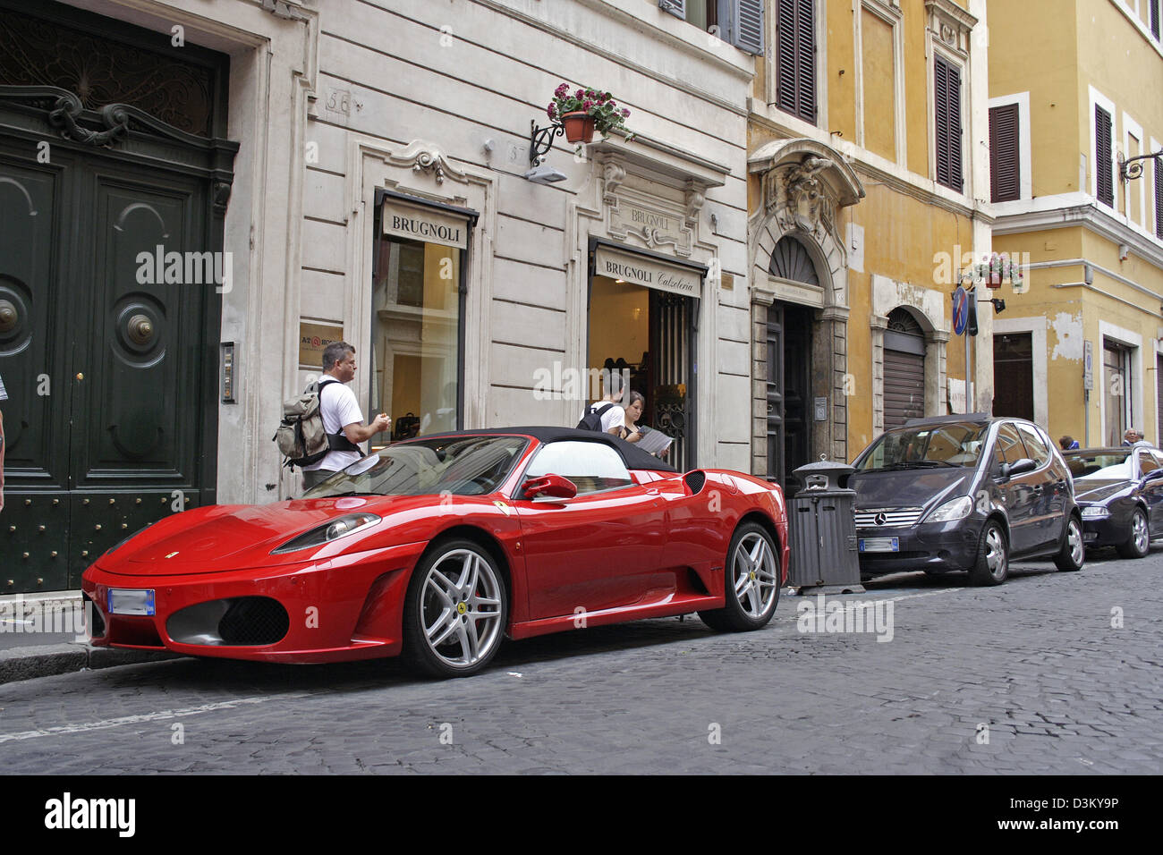(dpa) - A Ferrari stands at the road side in downtown Rome, Italy, 17 ...