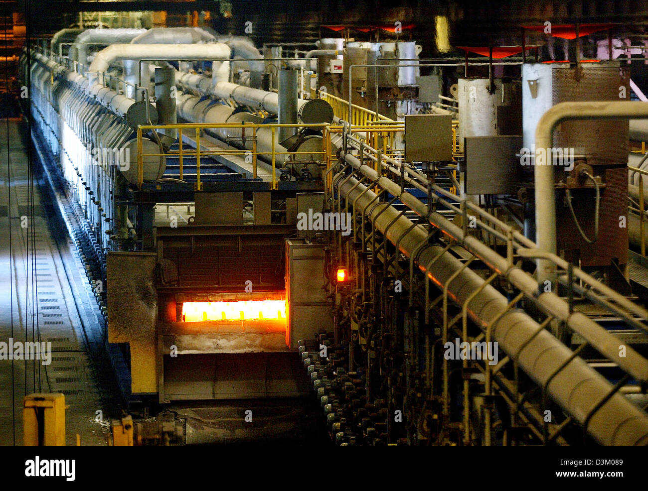 (dpa) - A steel slab runs through the roller hearth furnace of the slab ...