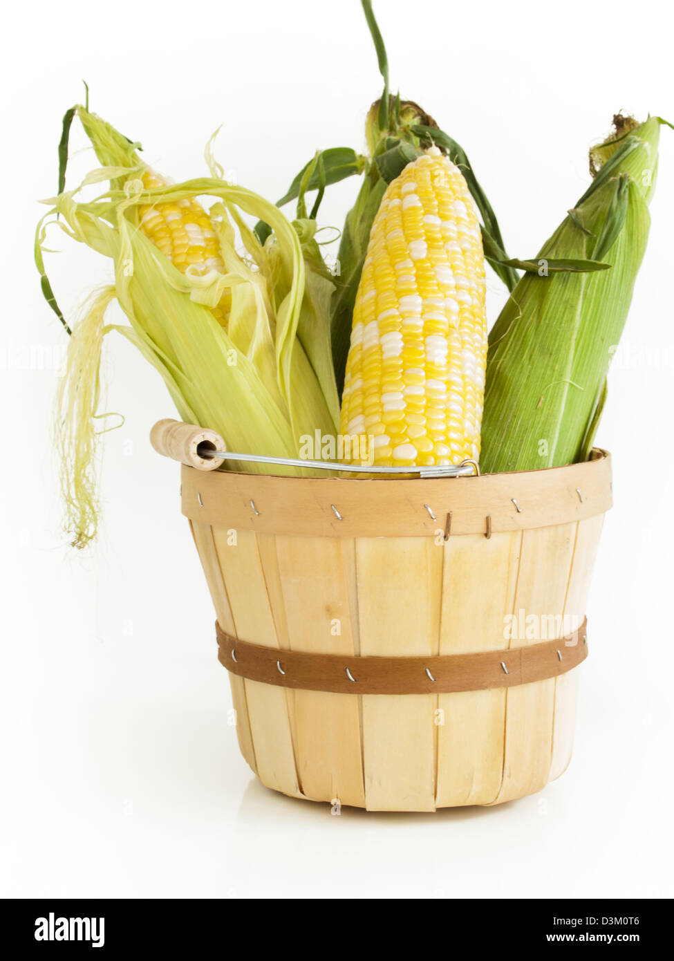 Olathe sweet corn in basket on white background Stock Photo - Alamy