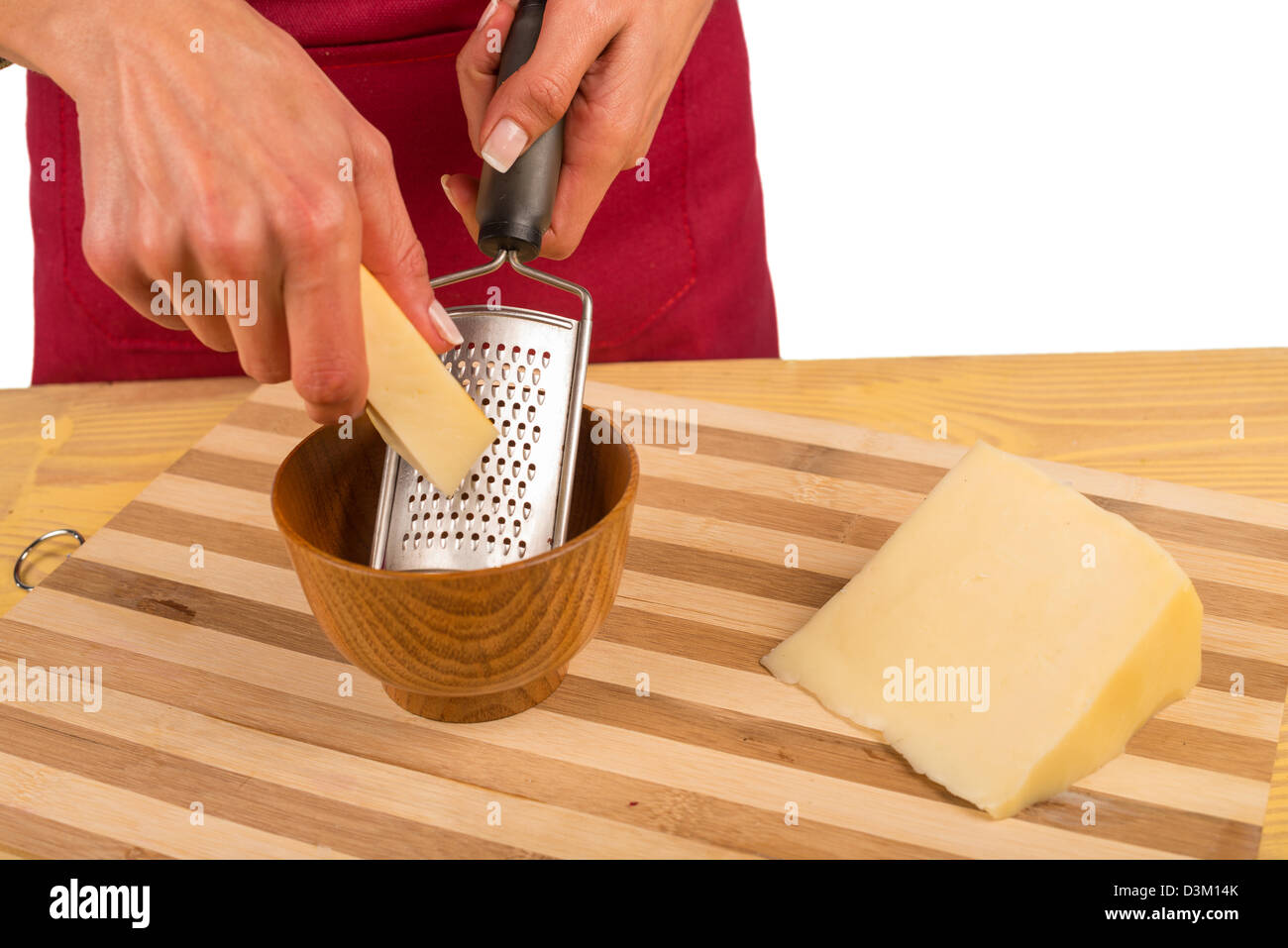 Grating cheese for the extra fresh flavor Stock Photo - Alamy
