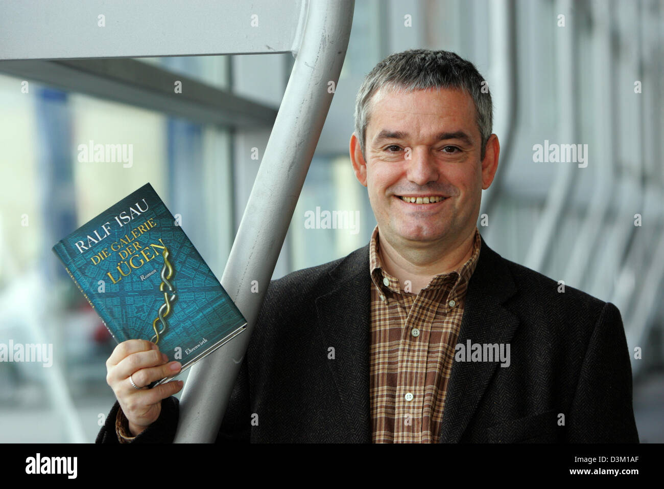 (dpa) - German bestseller author Ralf Isau smiles at the Frankfurt Book ...