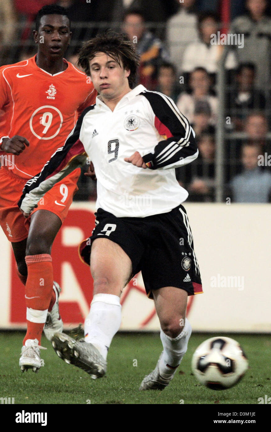 (dpa) - German forward Daniel Halfar (front) controls the ball in the ...