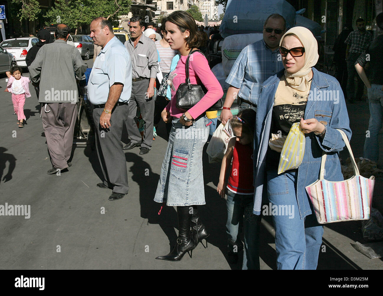 (dpa) - Veiled and unveiled women walk through downtown Aleppo, Syria ...