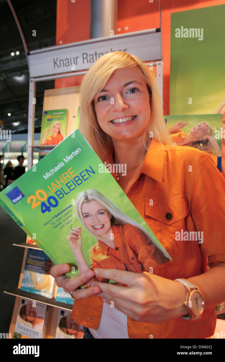 (dpa) - Actress and author Michaela Merten smiles at the Frankfurt Book ...