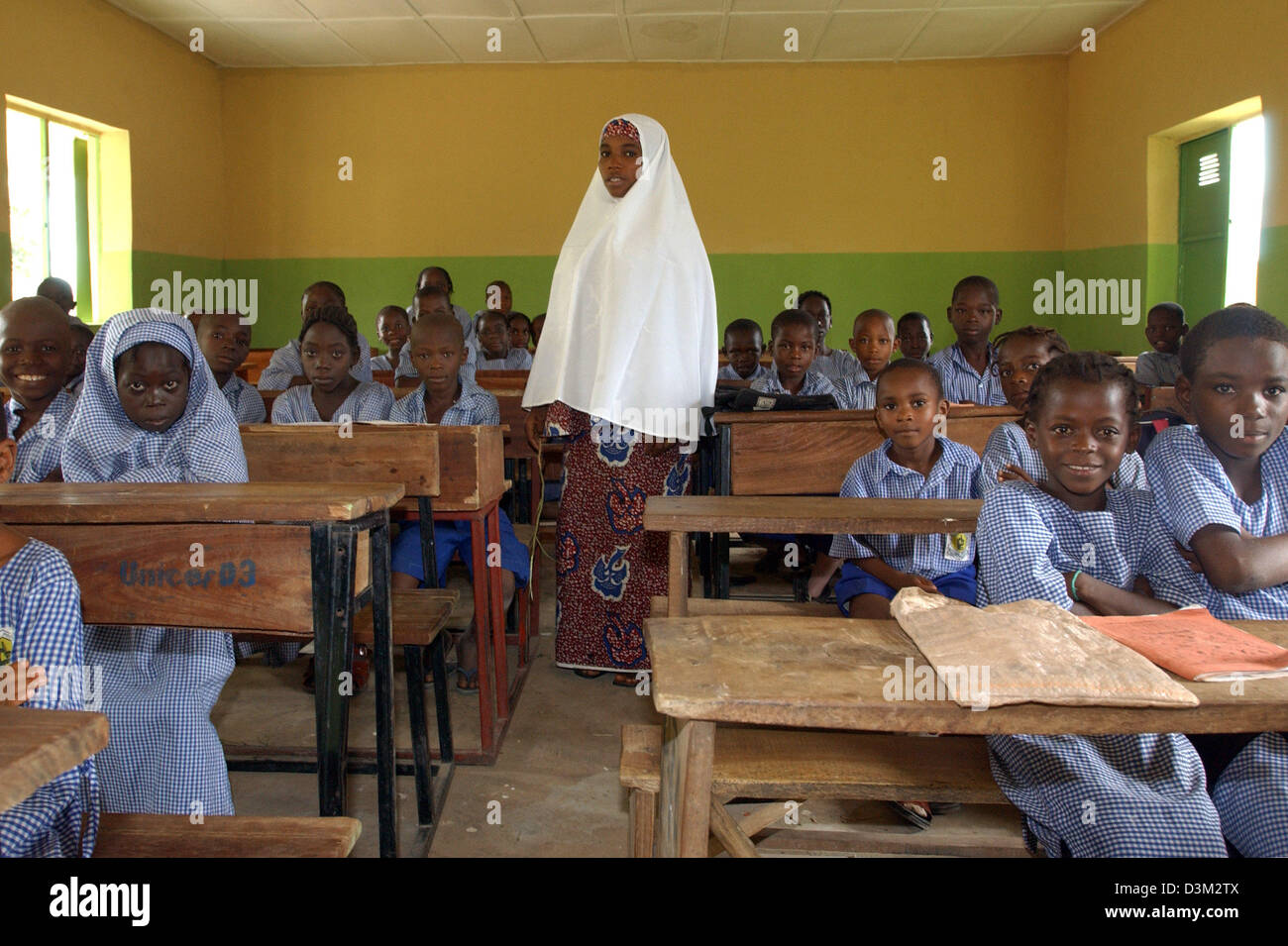 (dpa) - The picture shows a young Muslim teacher with her class at a ...