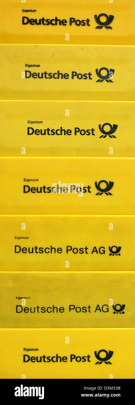 (dpa) - Stacked mailboxes with the logo of the 'Deutsche Post' pictured ...
