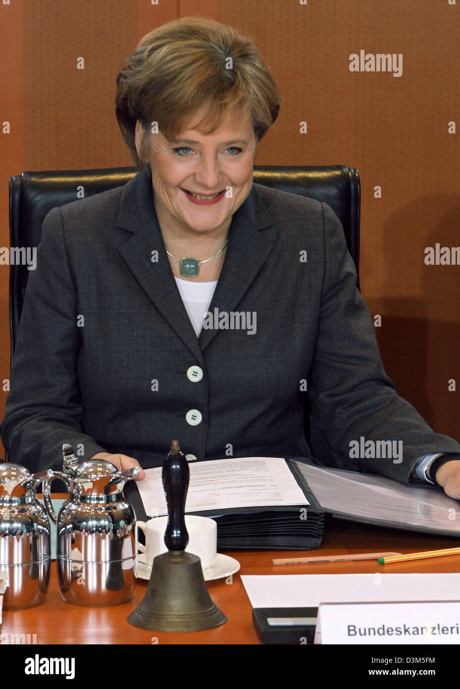 (dpa) - German Chancellor Angela Merkel (CDU) smiles prior to the new ...