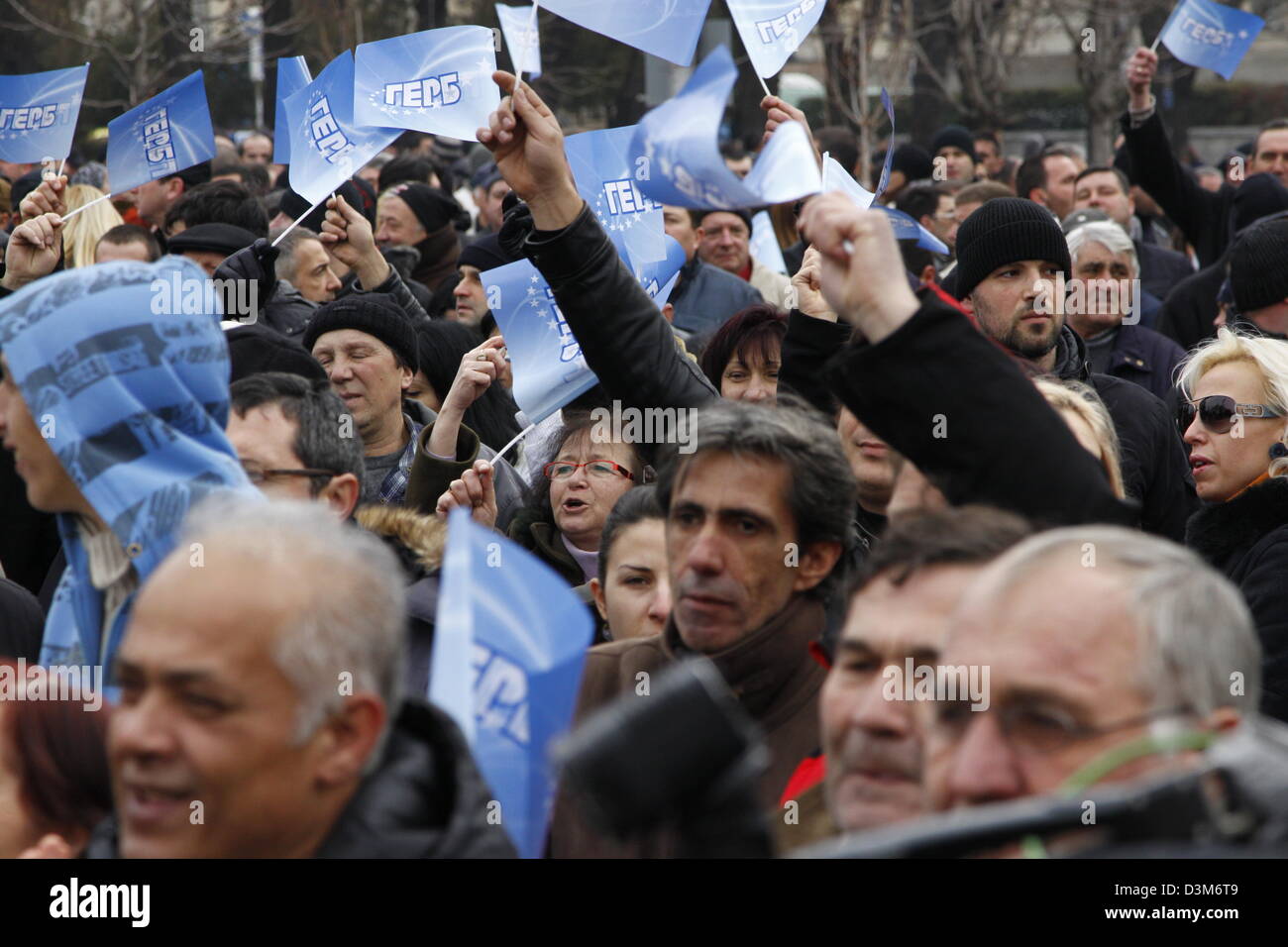 Sofia, Bulgaria; 21/02/2013. Demonstrators waving GERB party flags in ...