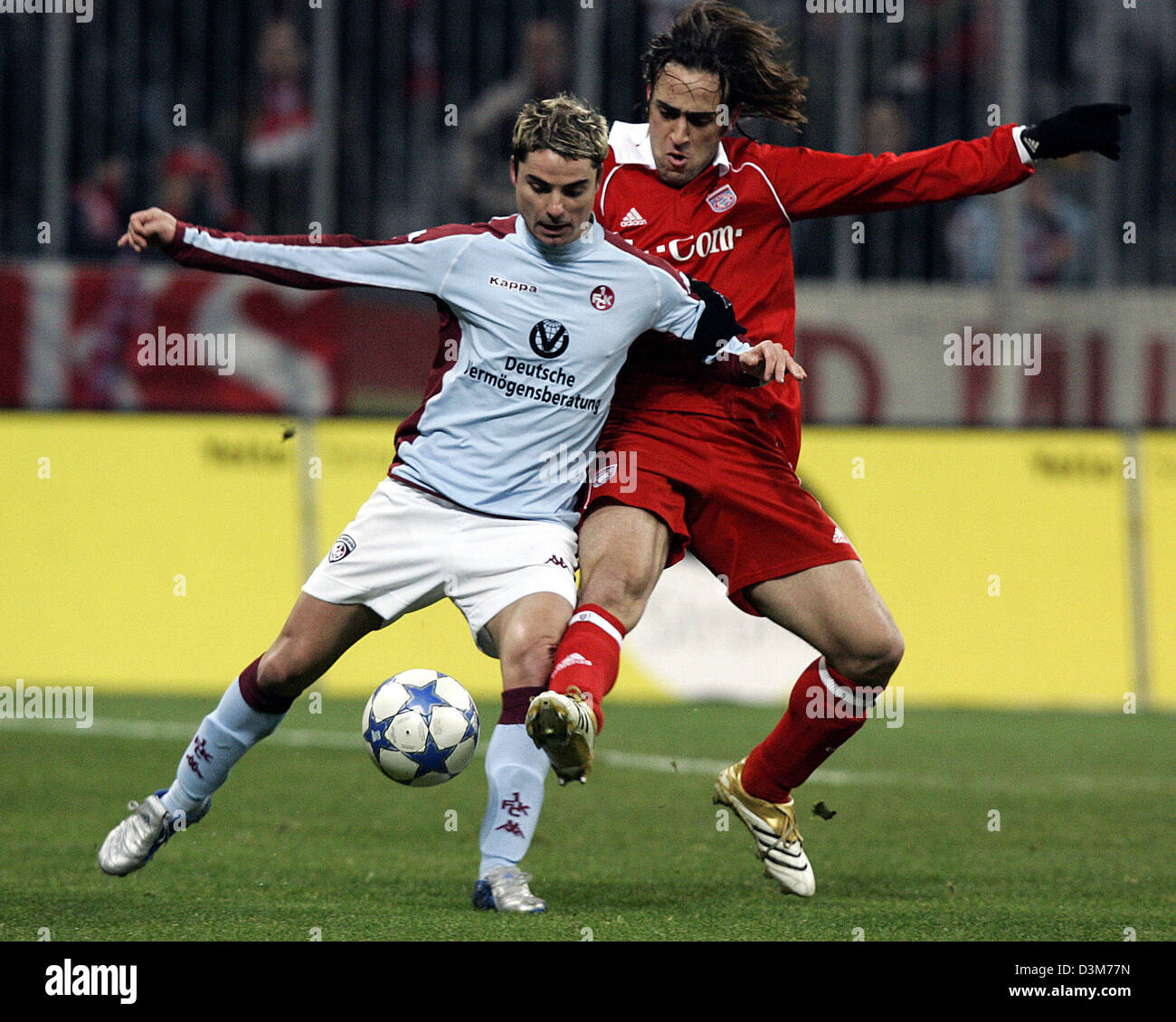 (dpa) - Munich's Ali Karimi (R) fights for the ball with Kaiserslautern ...