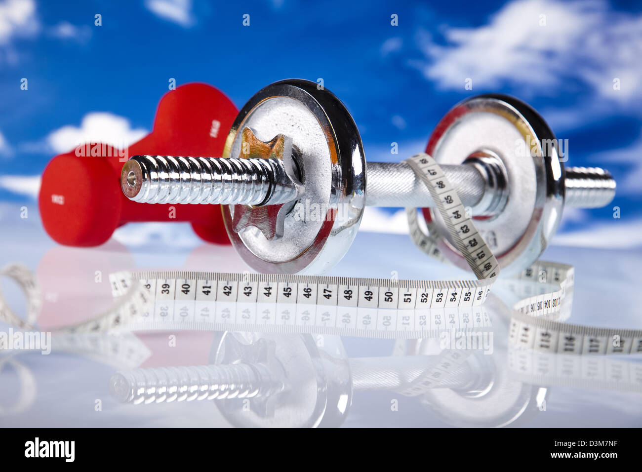 Measuring of dumbbell Stock Photo - Alamy