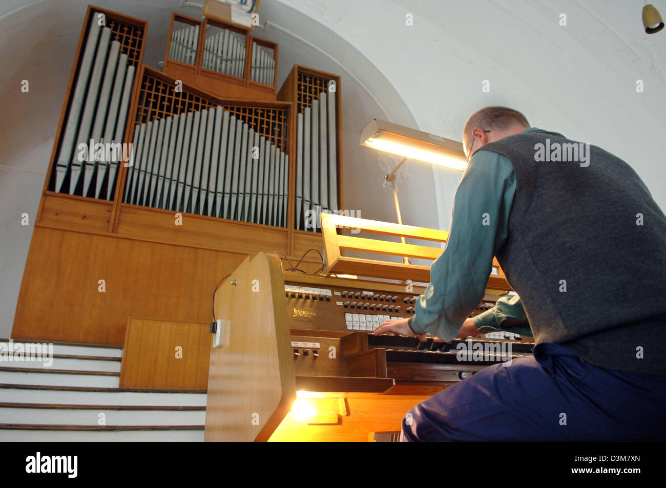(dpa) - A prison inmate plays on an organ in the prison chapel at the ...